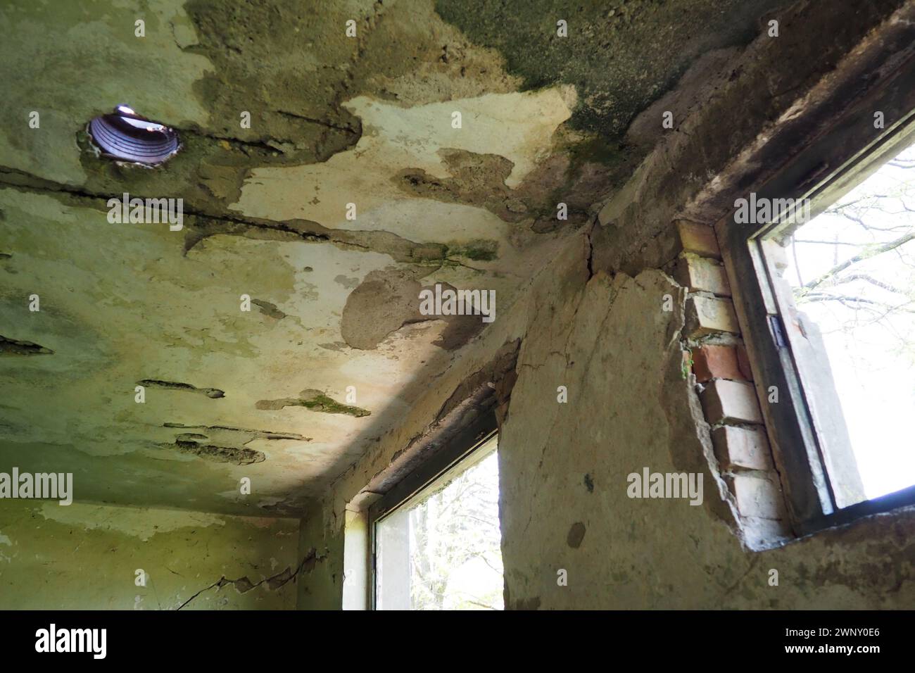 Abandoned building interior. A shabby desolate room with empty broken ...