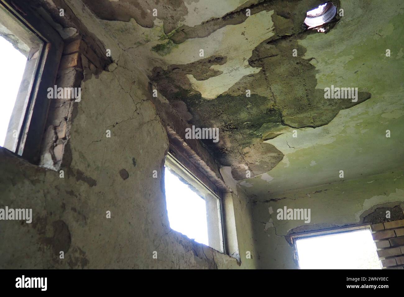 Abandoned building interior. A shabby desolate room with empty broken ...