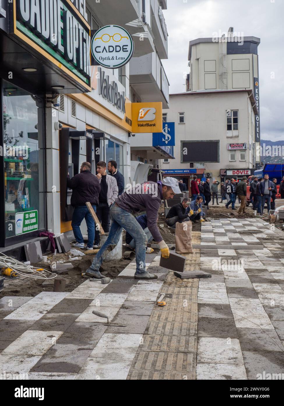Hopa, Turkye. 02.20.2024 Workers lay tiles in the city. Renovation of ...