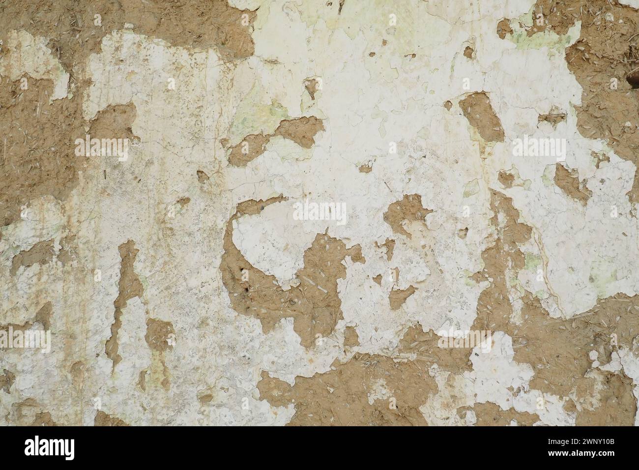 The wall of a residential old house built with bricks made from mud ...