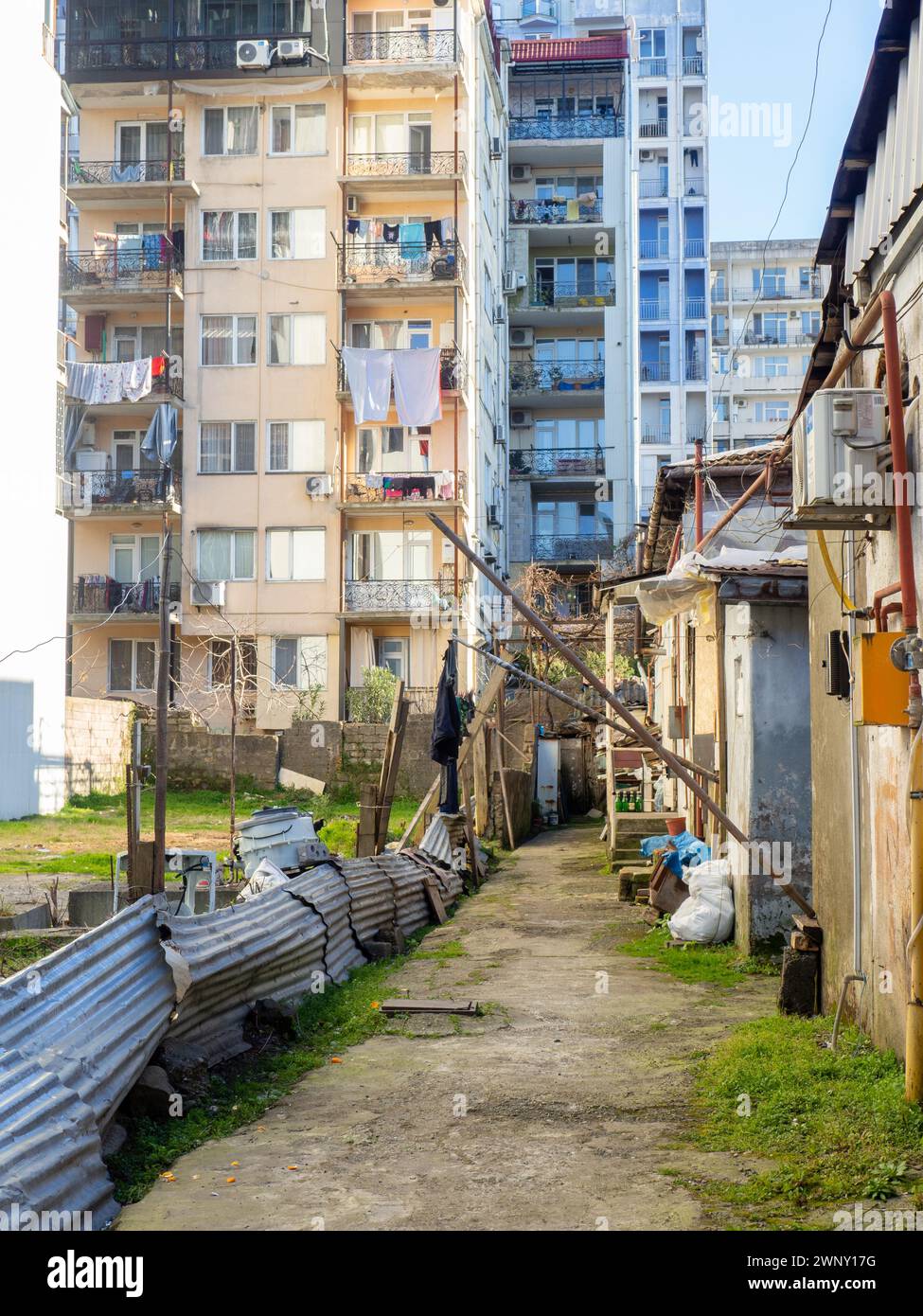 Local slums. Housing of local residents. Asian contrast in architecture ...