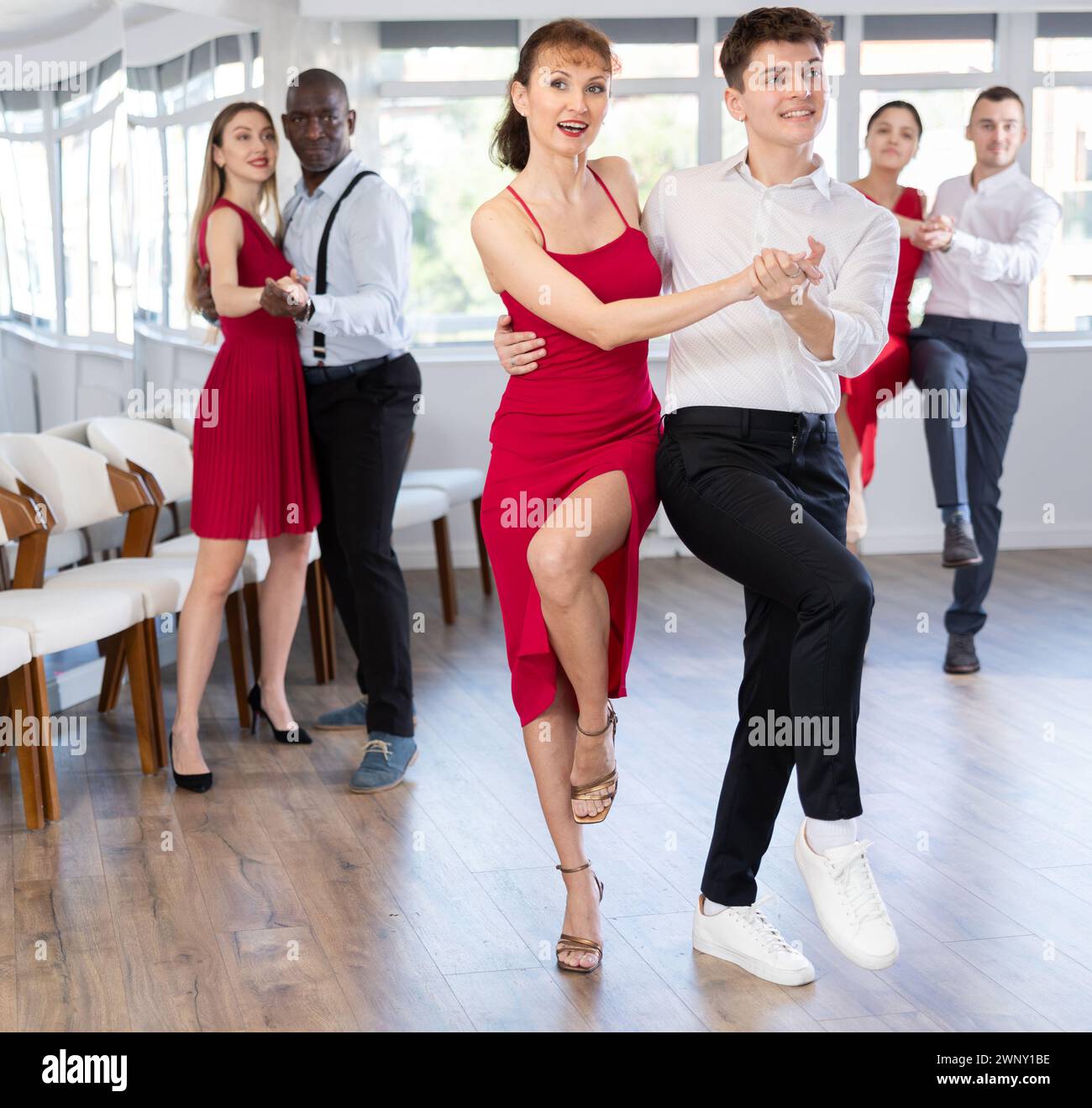 Woman dances incendiary boogie woogie with man partner during ...