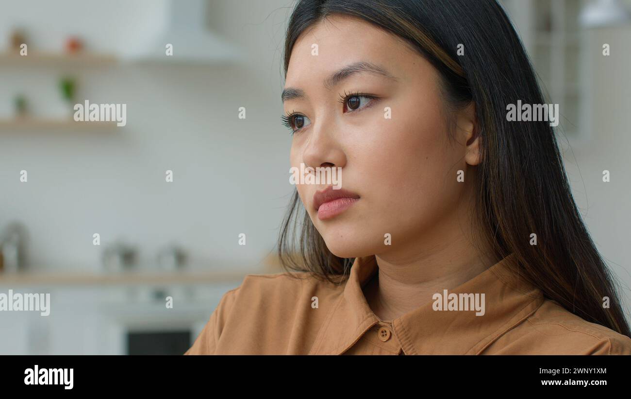 Close up view lonely Asian woman thoughtful pensive korean girl looking ...