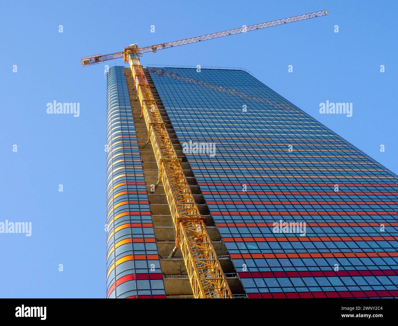 View of the construction of a skyscraper from the bottom up. The crane ...