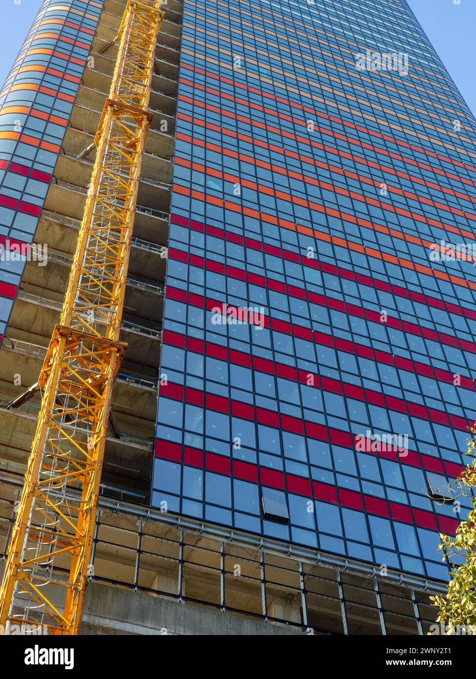 View of the construction of a skyscraper from the bottom up. The crane ...