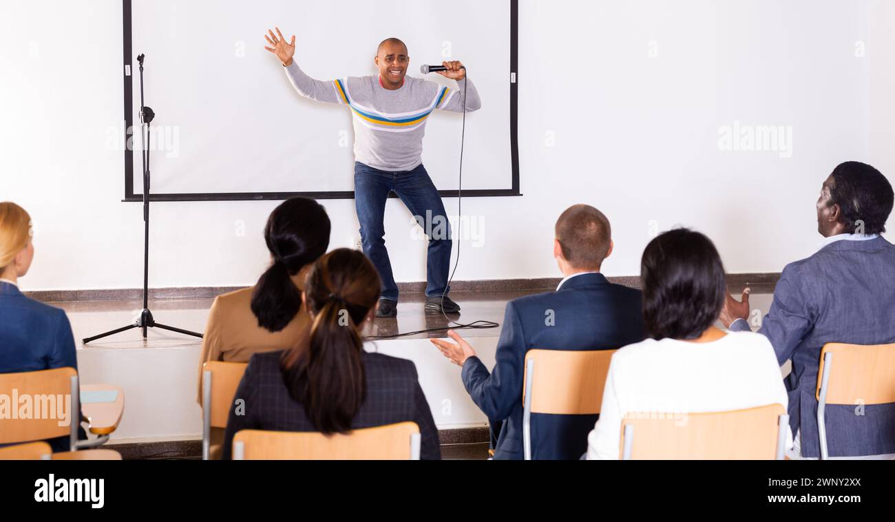 Emotional hispanic business coach giving motivational training Stock ...