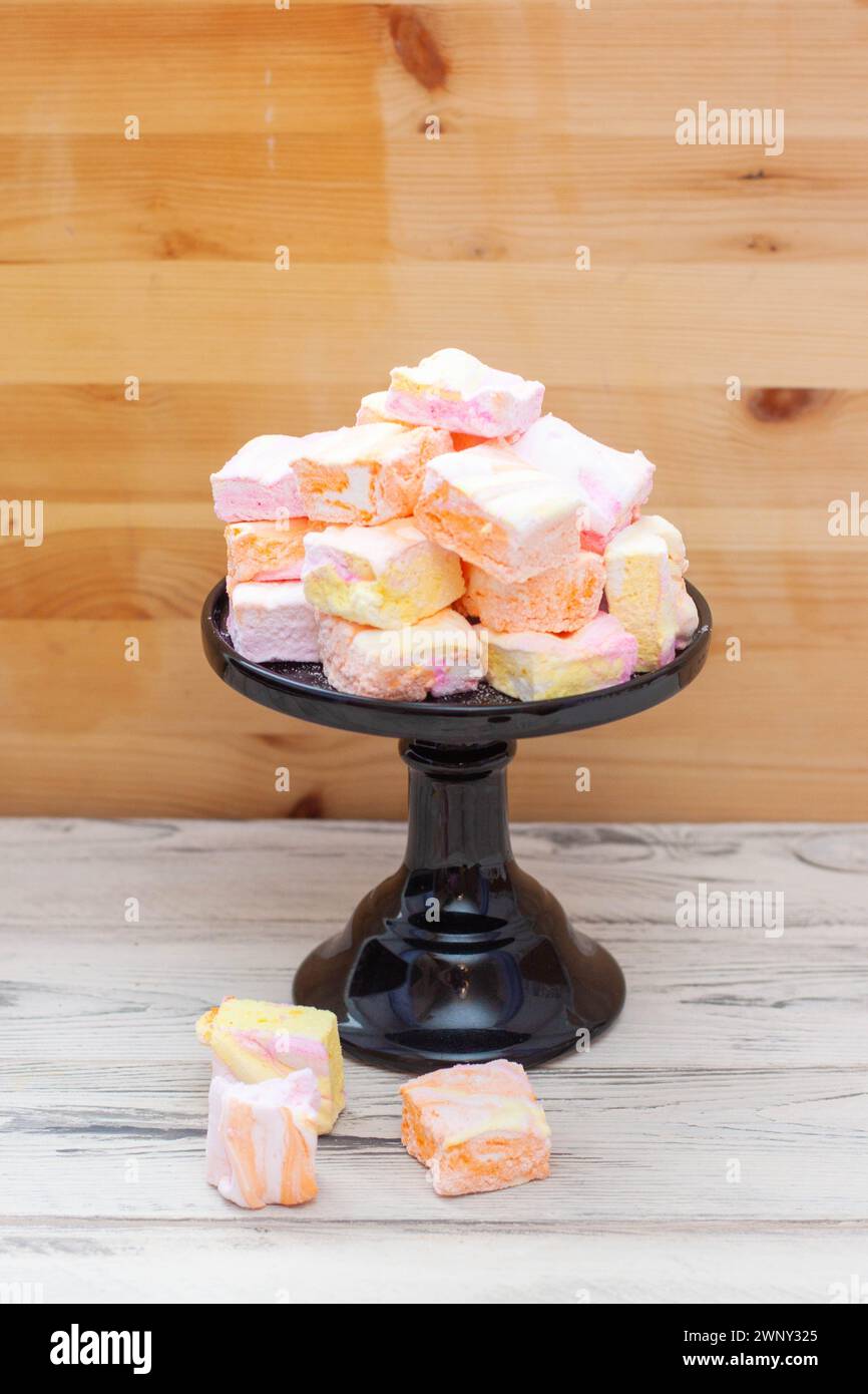 Colorful pink, orange and yellow homemade marshmallows made of egg ...