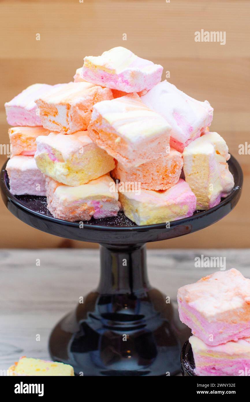 Colorful pink, orange and yellow homemade marshmallows made of egg ...
