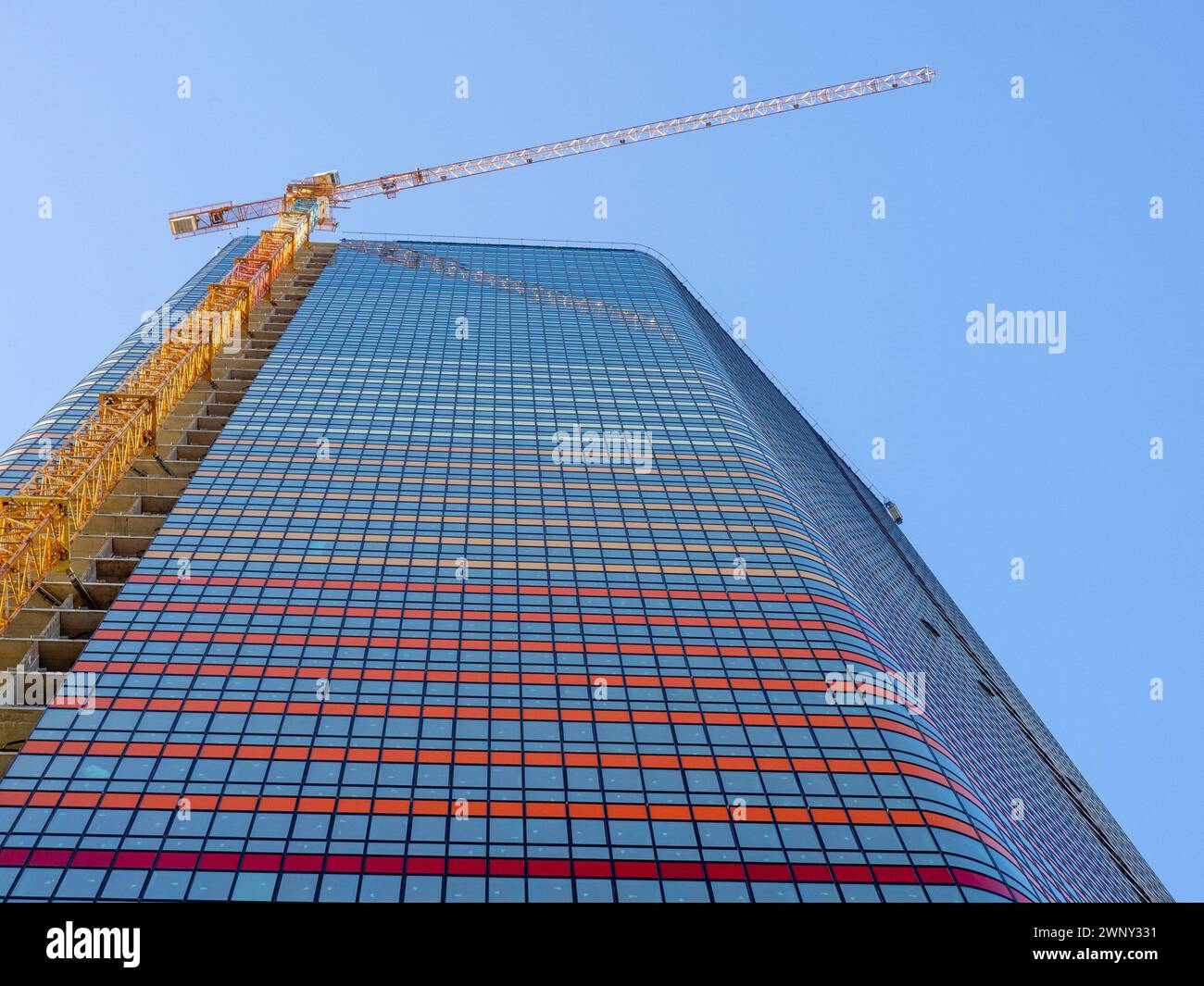 View of the construction of a skyscraper from the bottom up. The crane ...
