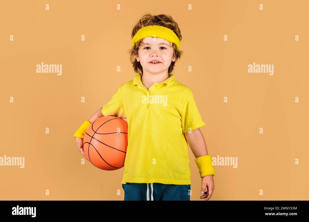 Sport for children. Little basketball player in sports uniform with ...