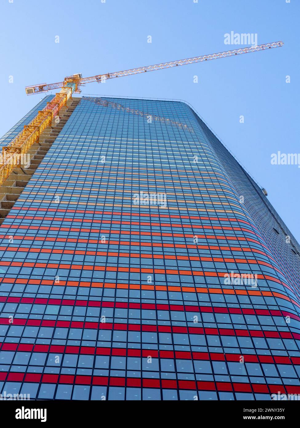 View of the construction of a skyscraper from the bottom up. The crane ...