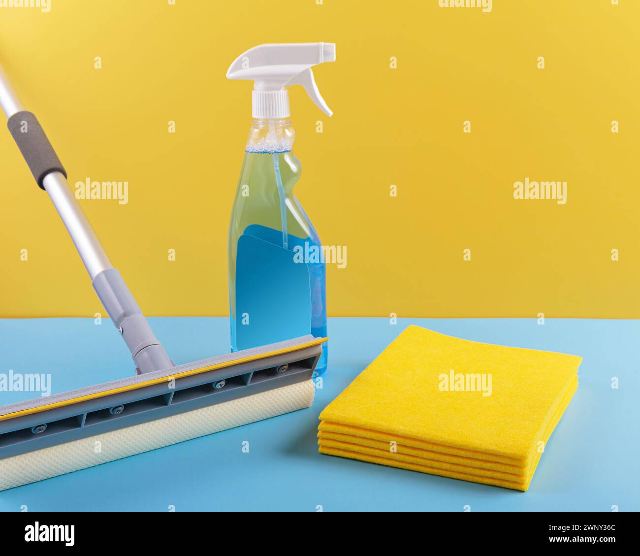 Set for cleaning windows on blue background Stock Photo - Alamy