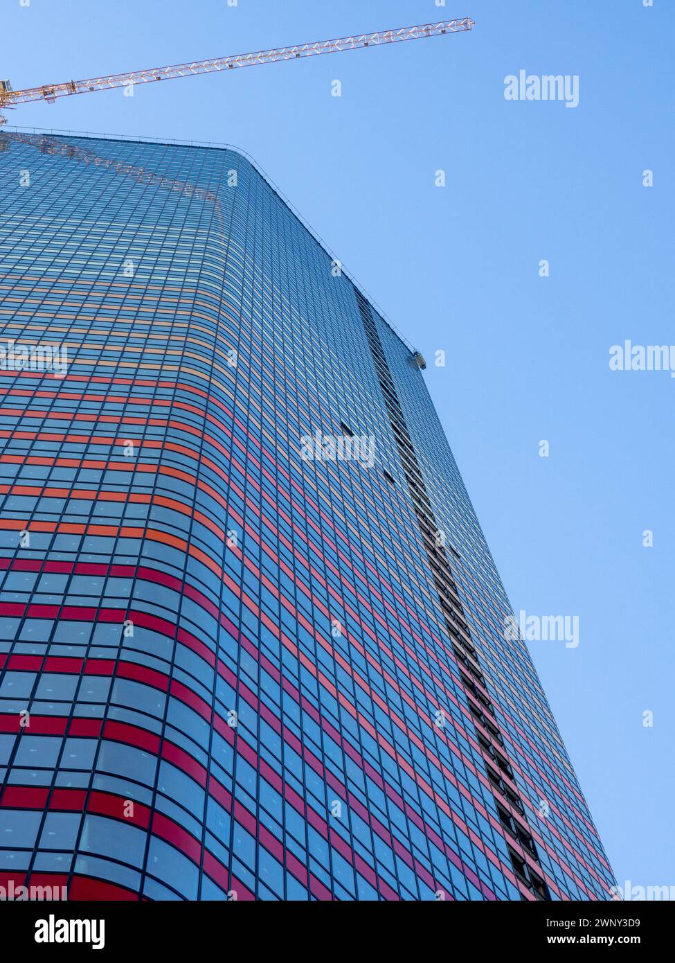 View of the construction of a skyscraper from the bottom up. The crane ...