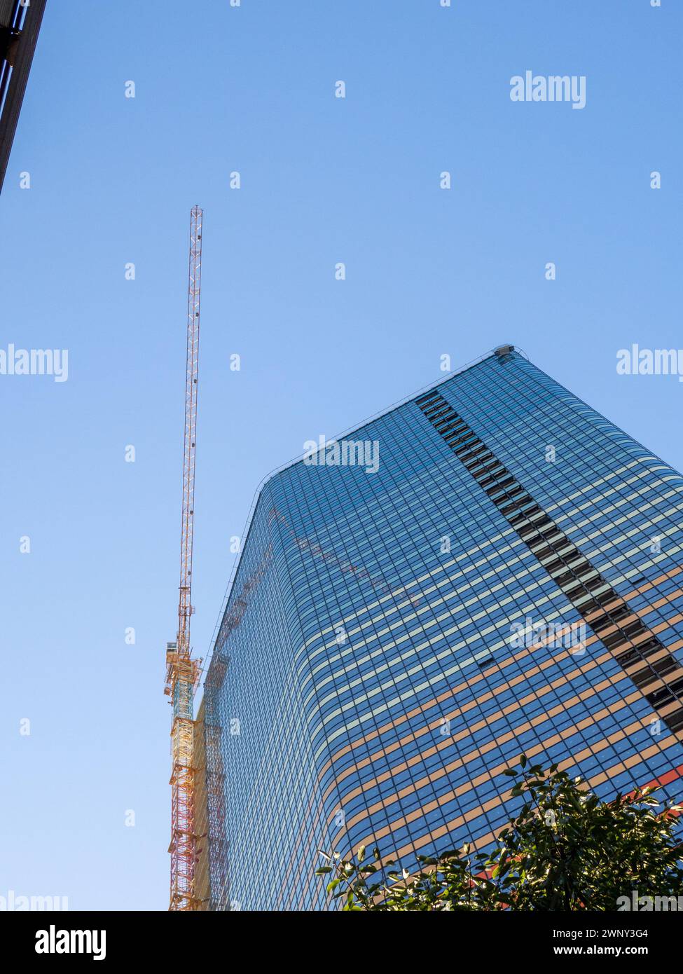 View of the construction of a skyscraper from the bottom up. The crane ...