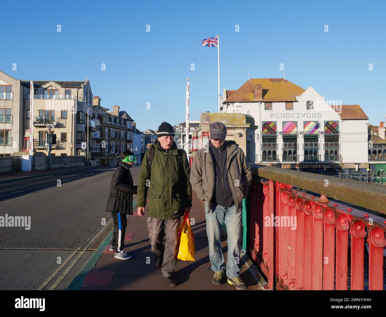People walking across Weymouth Town Bridge in the Old Town of Weymouth ...