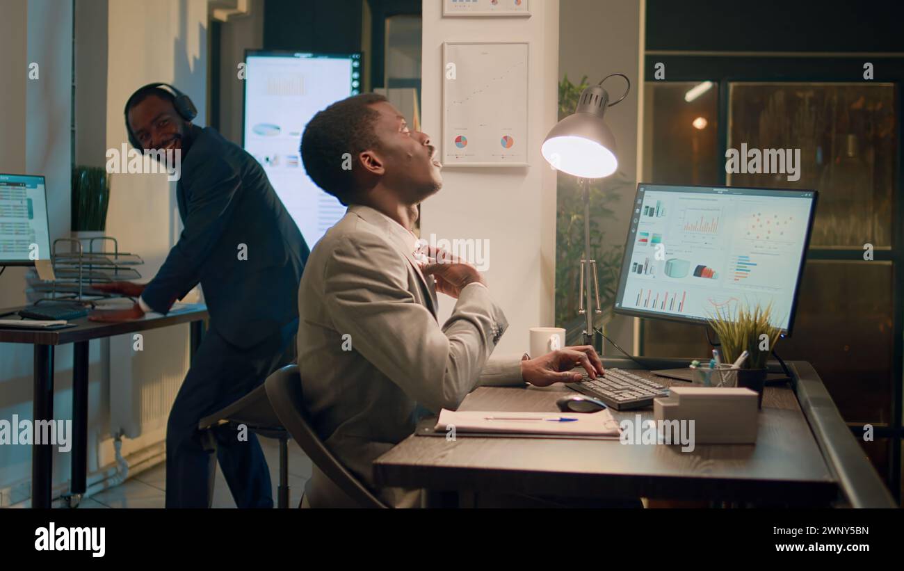 Computer operator fed up with coworker having fun at work pretending to ...