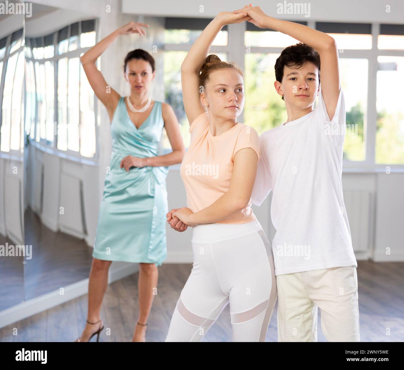 Passionate teen dancers, girl and boy practicing ballroom dancing in studio Stock Photo - Alamy