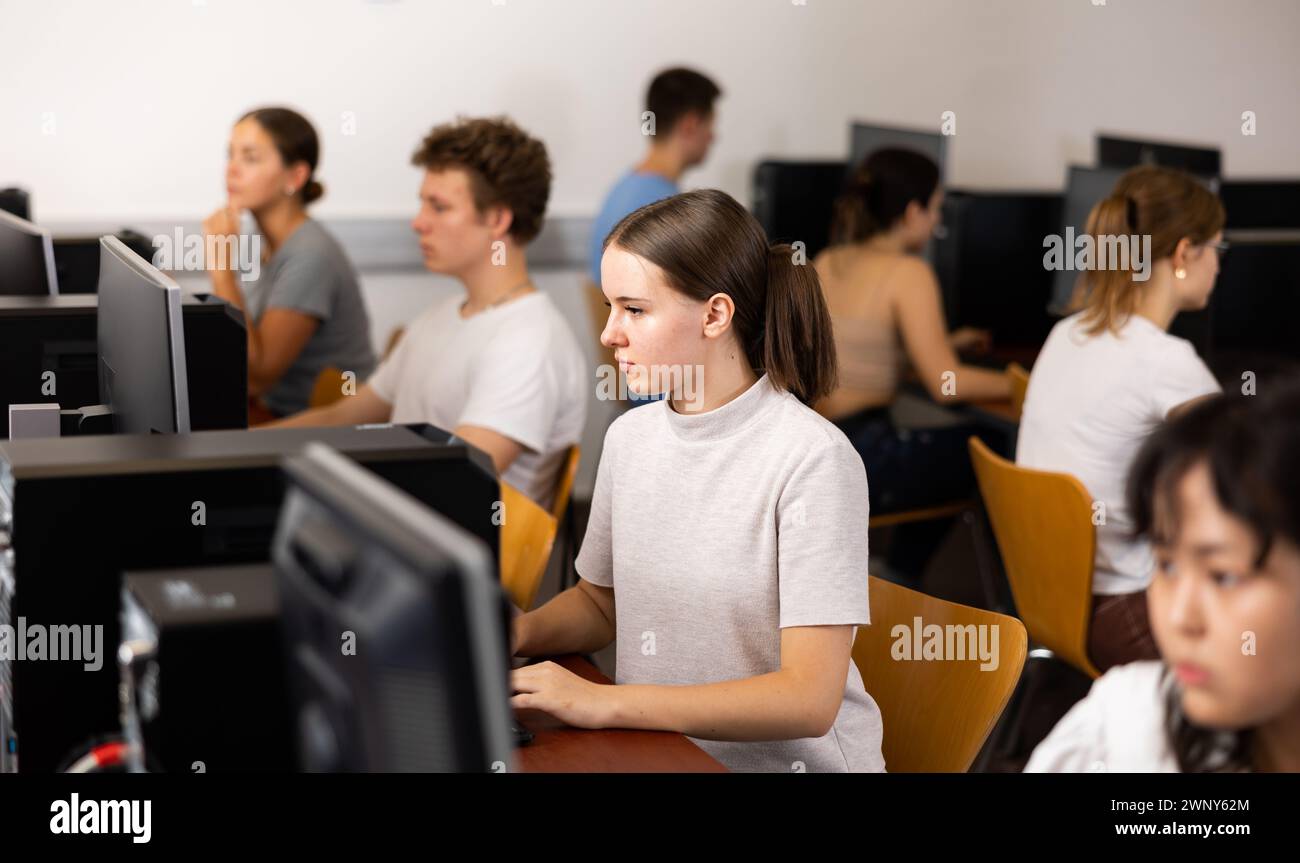 Teenager girl using PC during computer science lesson Stock Photo - Alamy