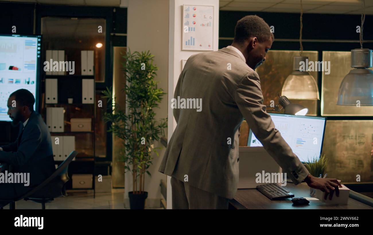 Employee finishing last office day, quitting stressful job after being ...