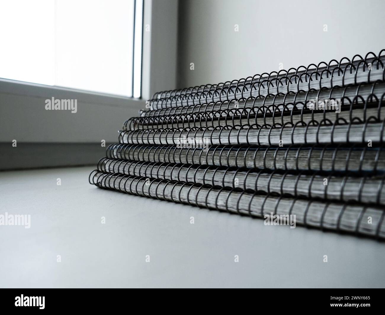 A stack of spring notebooks. Thick notebooks or notebooks placed on top ...