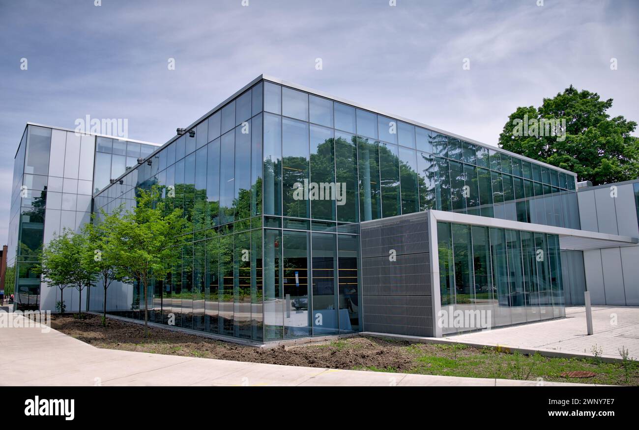 A modern campus building with a sleek glass facade that epitomizes ...