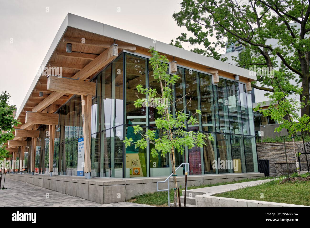 A modern library building with a sleek glass facade that epitomizes ...