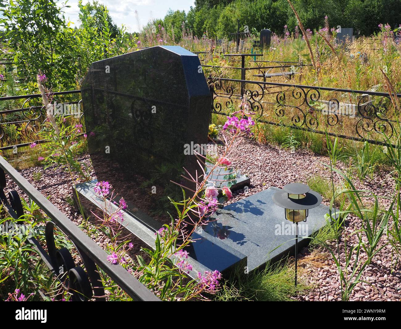 Cemetery with stone monuments. Old abandoned cemetery in the afternoon ...