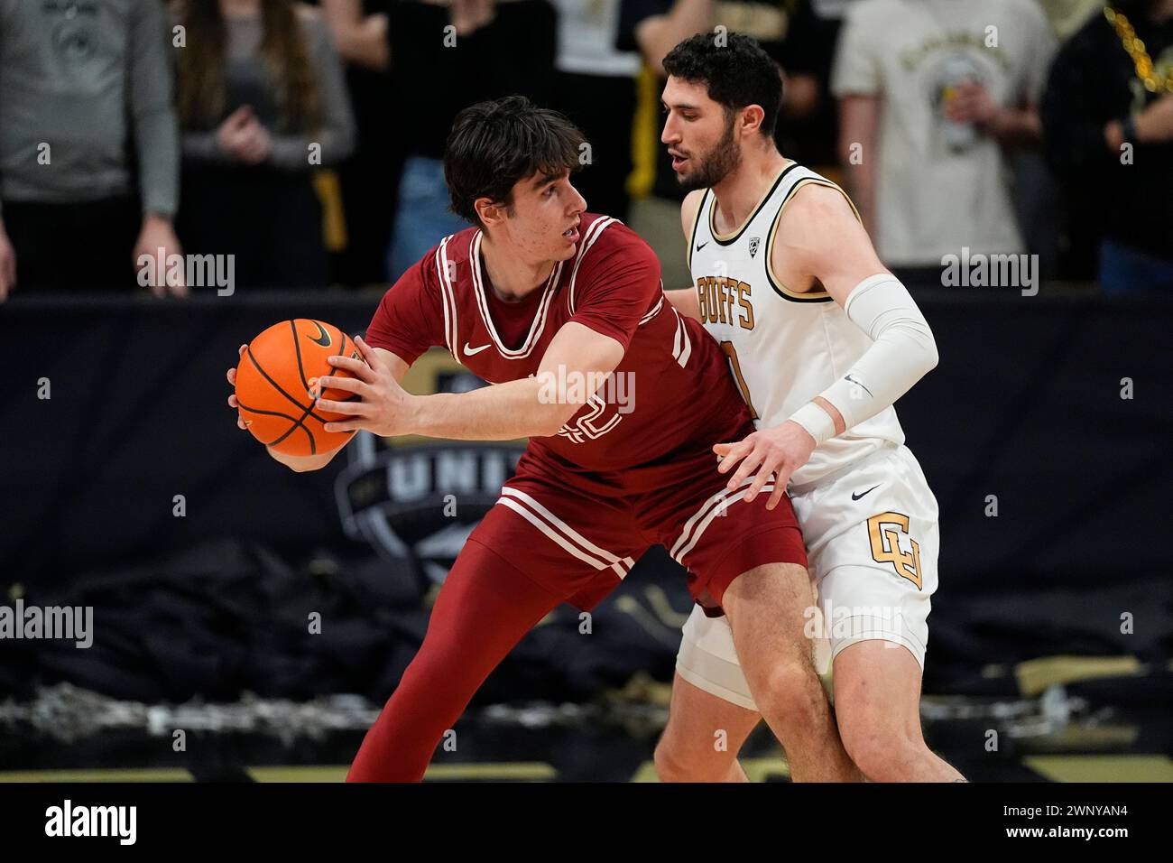 Stanford forward Maxime Raynaud (42) and Colorado guard Luke O'Brien (0 ...