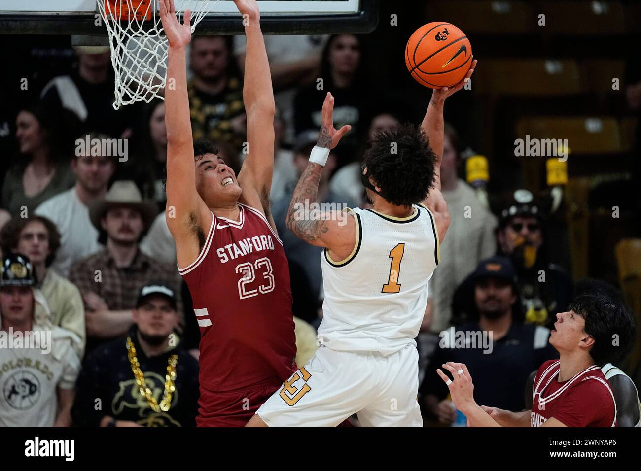 Stanford forward Brandon Angel (23) and Colorado guard J'Vonne Hadley ...