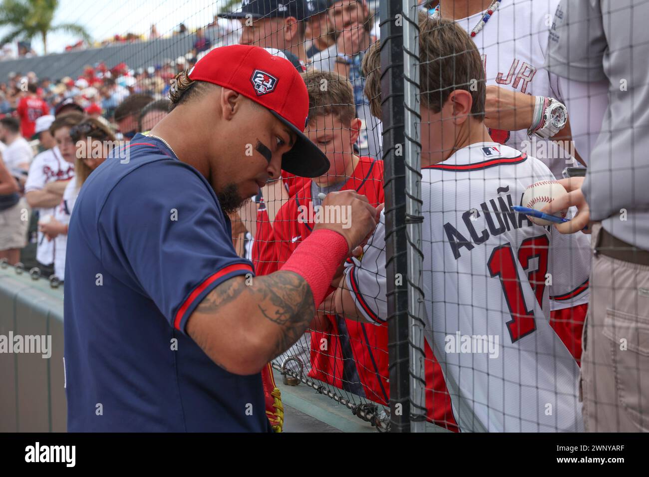 North Port FL USA; Atlanta Braves shortstop Orlando Arcia (11) signs a ...