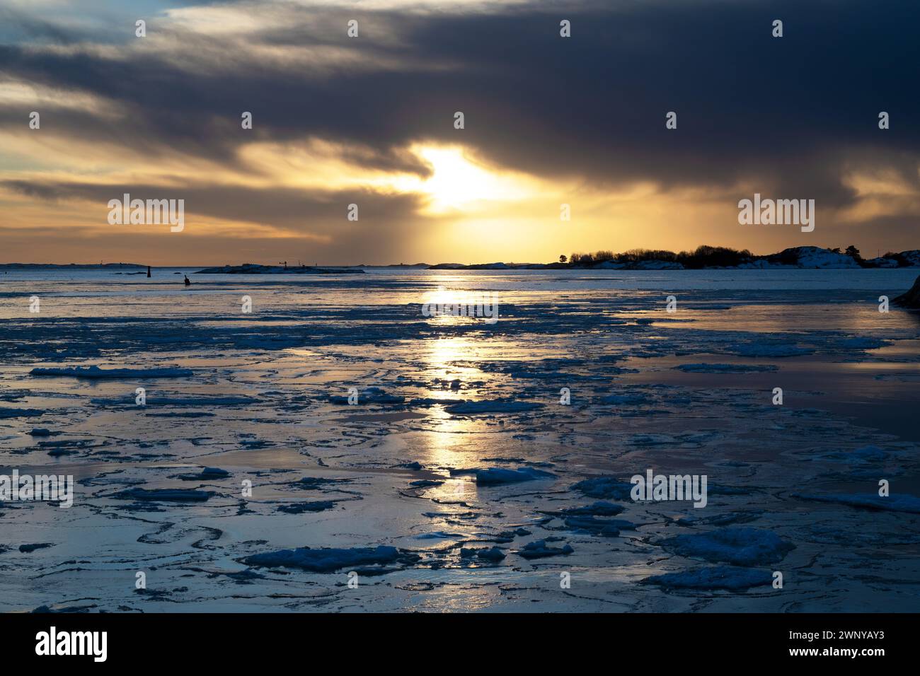 Sunset at winter shore Stock Photo - Alamy