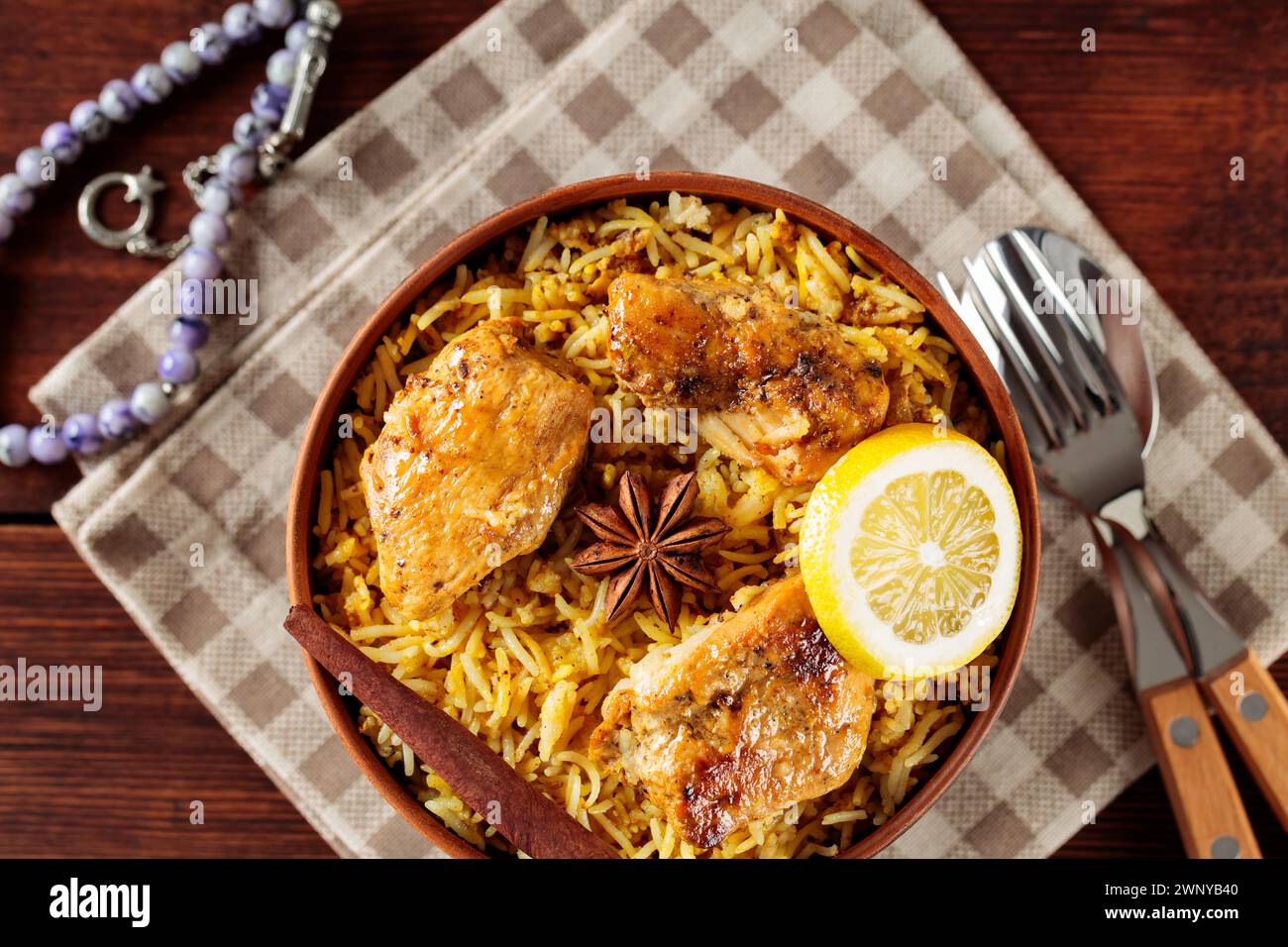 Halal Chicken Biryani with Spices and Lemon for Ramadan Iftar, Top View ...