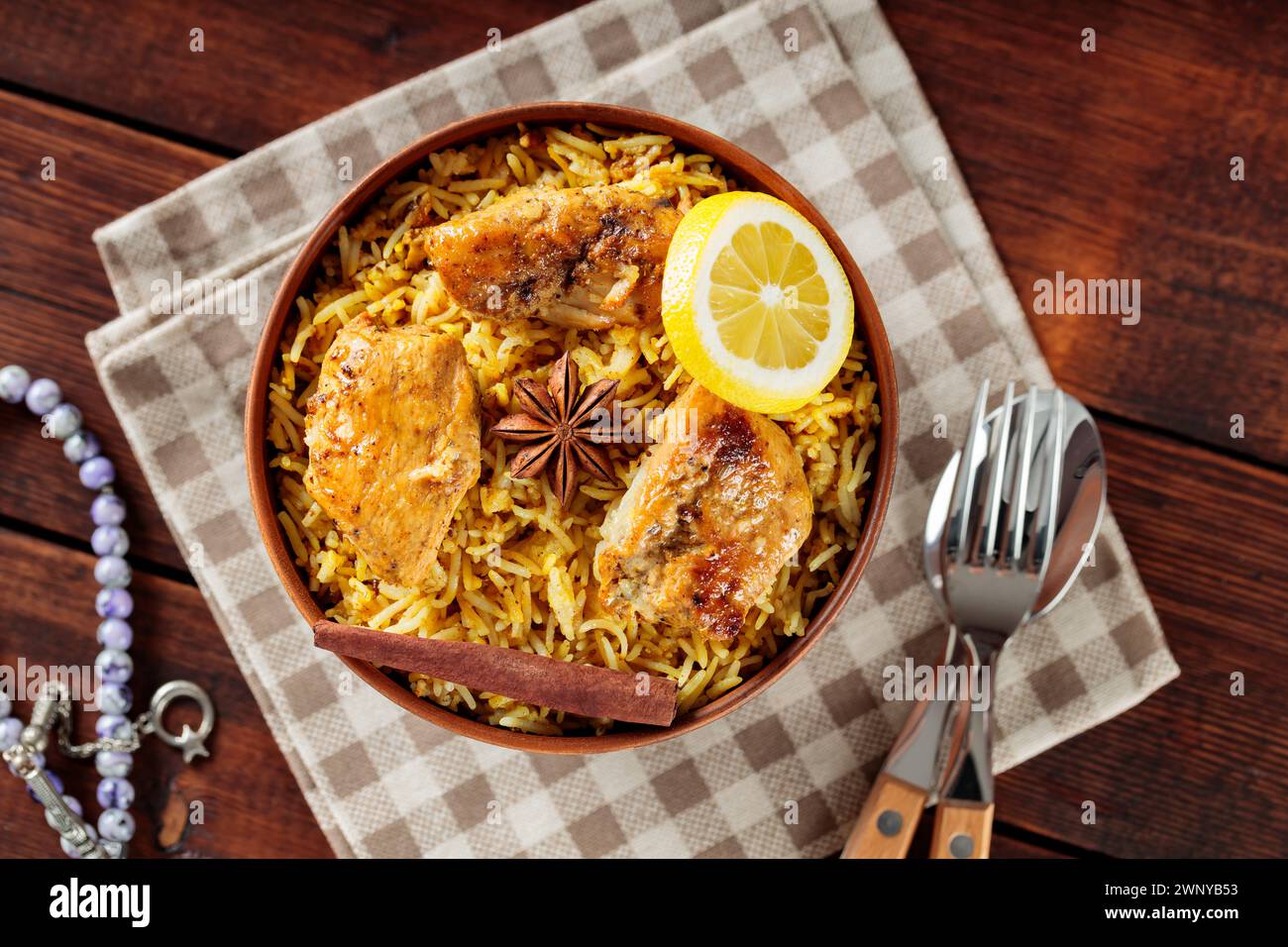 Halal Chicken Biryani with Spices and Lemon for Ramadan Iftar, Top View ...