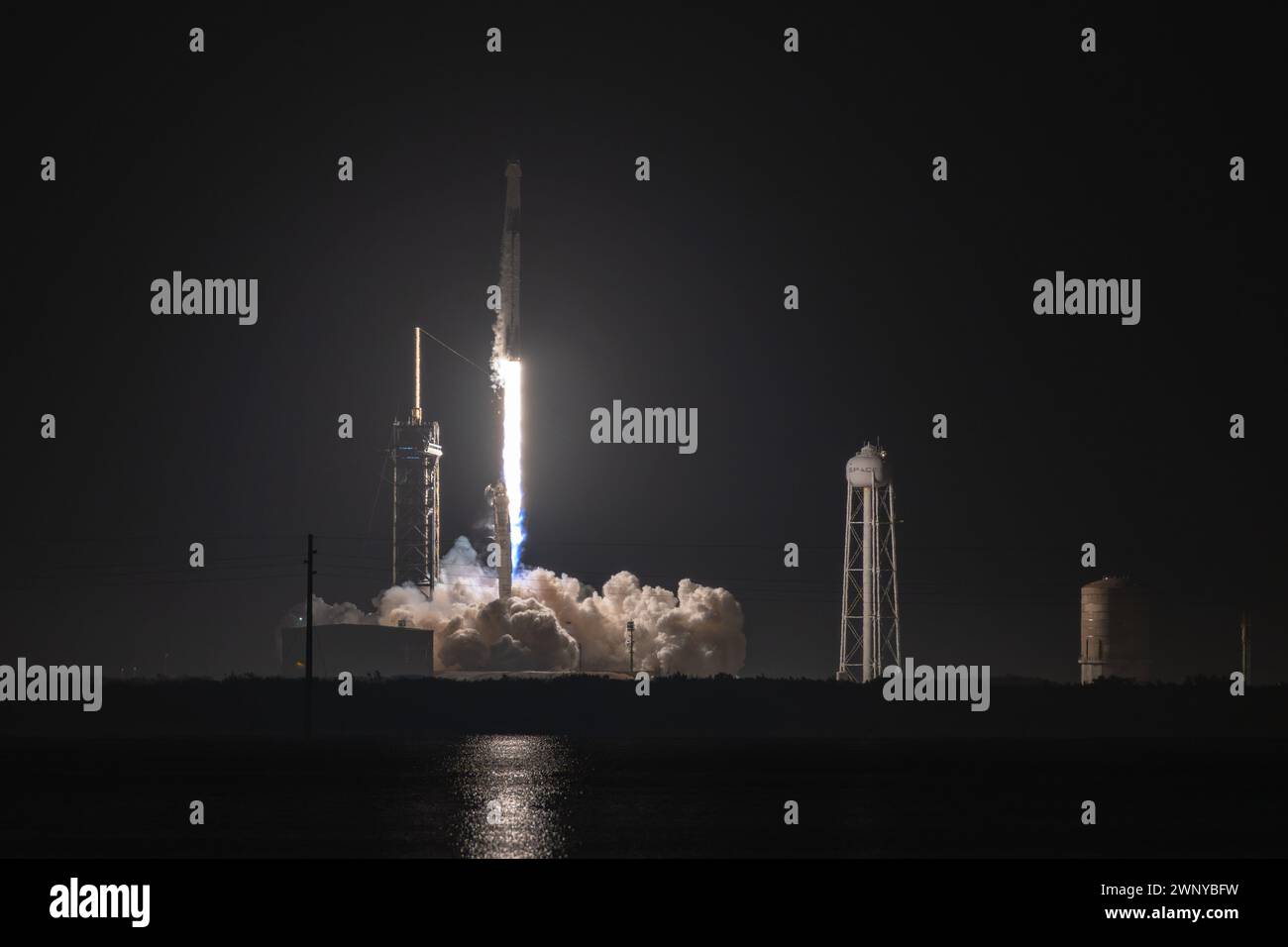 A Falcon 9 rocket carrying the Crew Dragon Spacecraft launches from ...