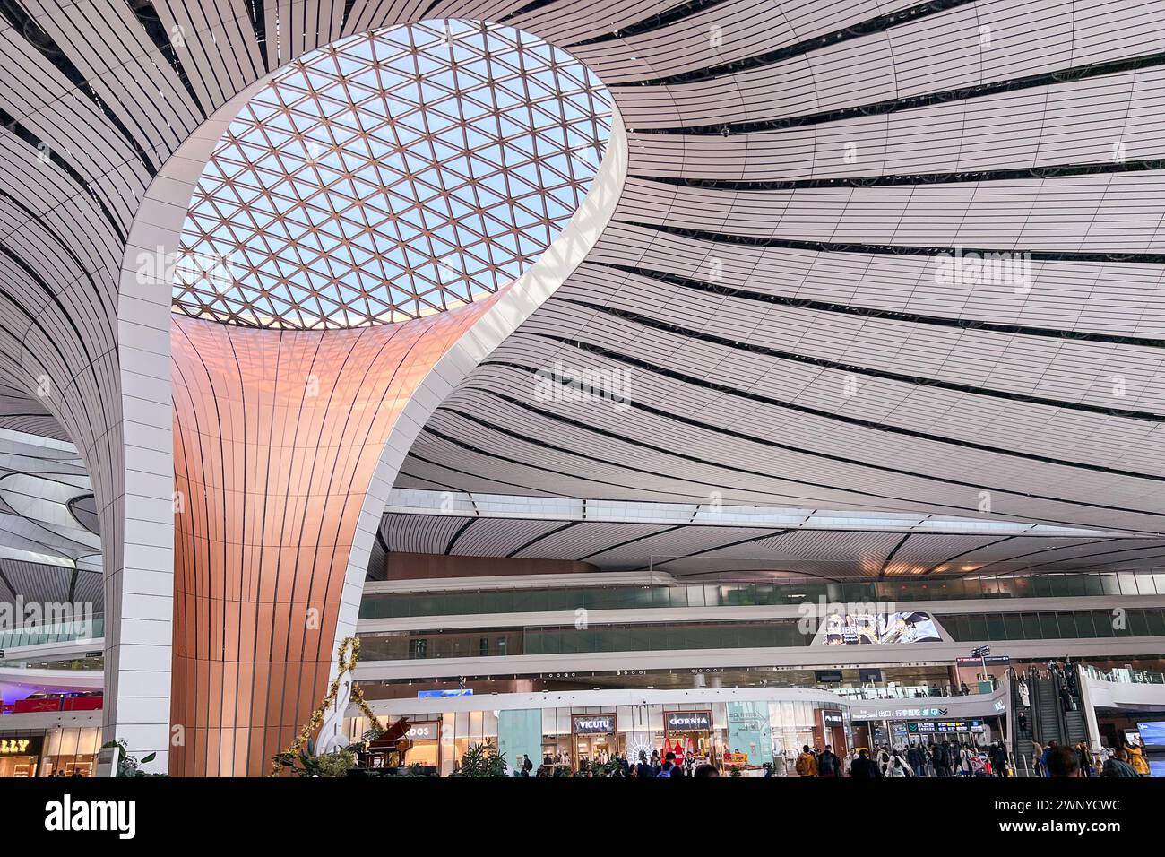 Passengers walk through Beijing Daxing International Airport on Dec. 8 ...