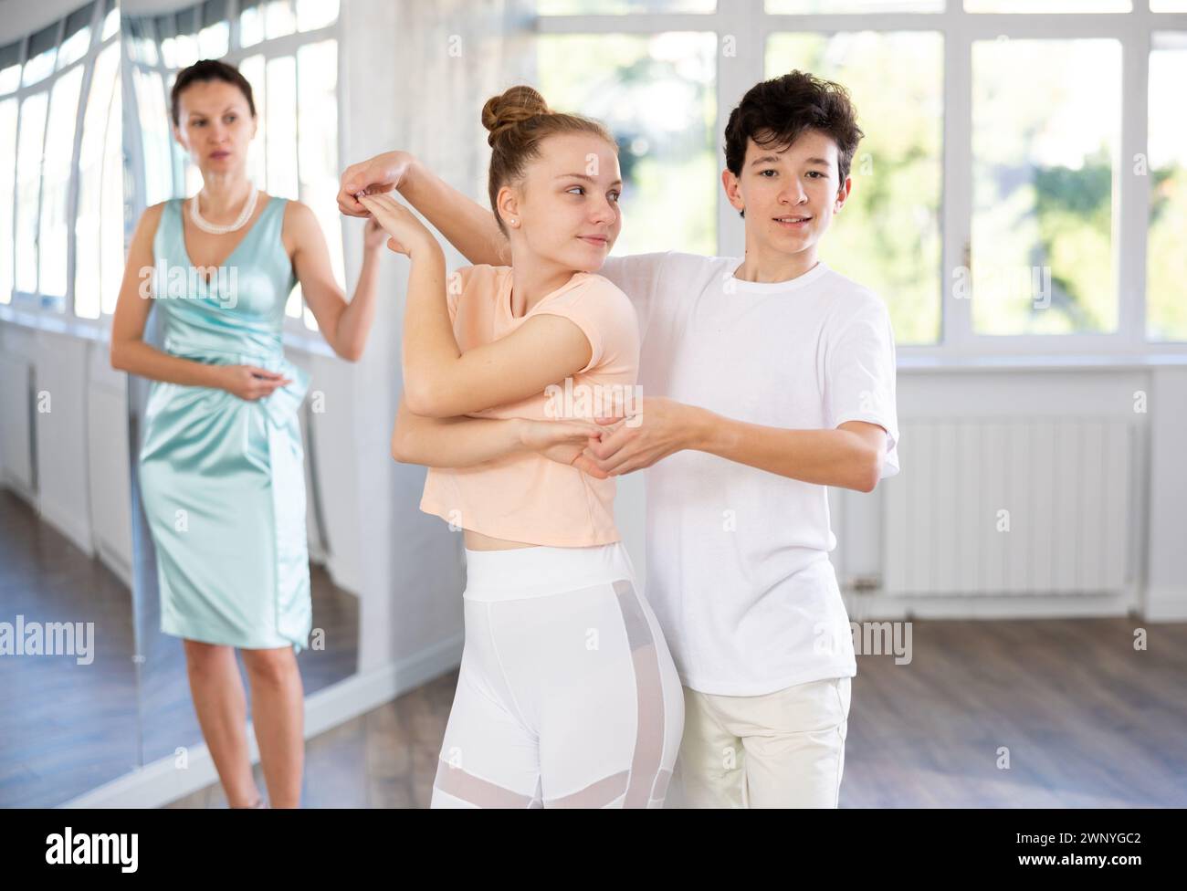 Passionate teen dancers, girl and boy practicing ballroom dancing in studio Stock Photo - Alamy