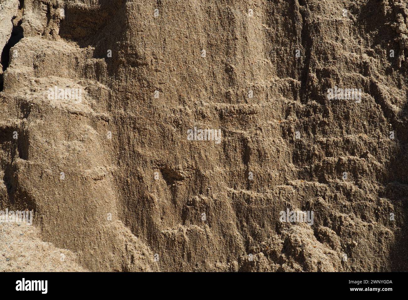 Sandstone is a fragmentary sedimentary rock, a homogeneous or layered ...