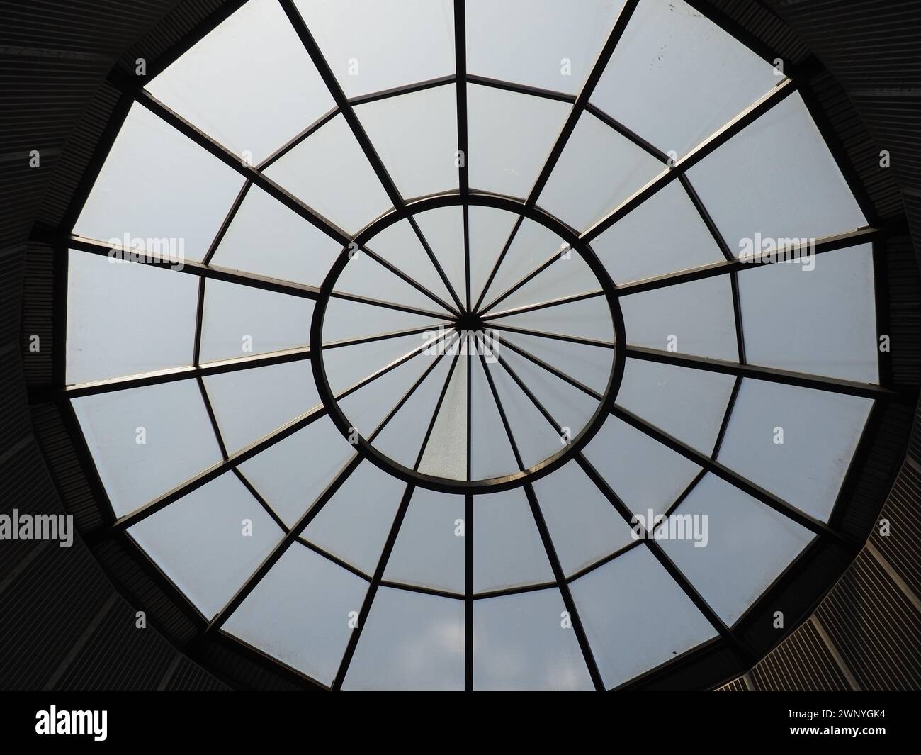 Glass dome or round window in the roof. The sky can be seen through a ...