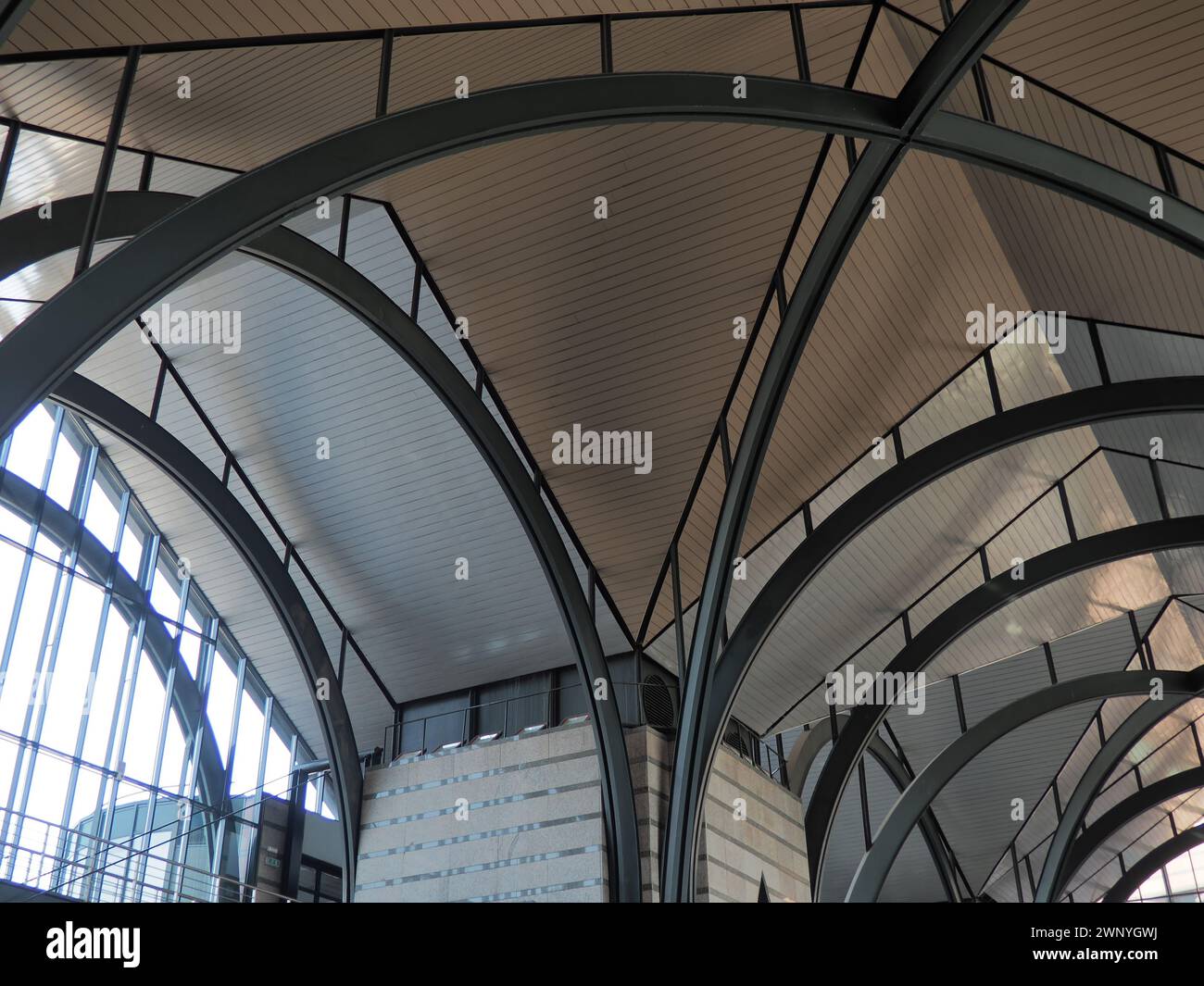 Arches and arches of the station. Metal structures under the roof of a ...