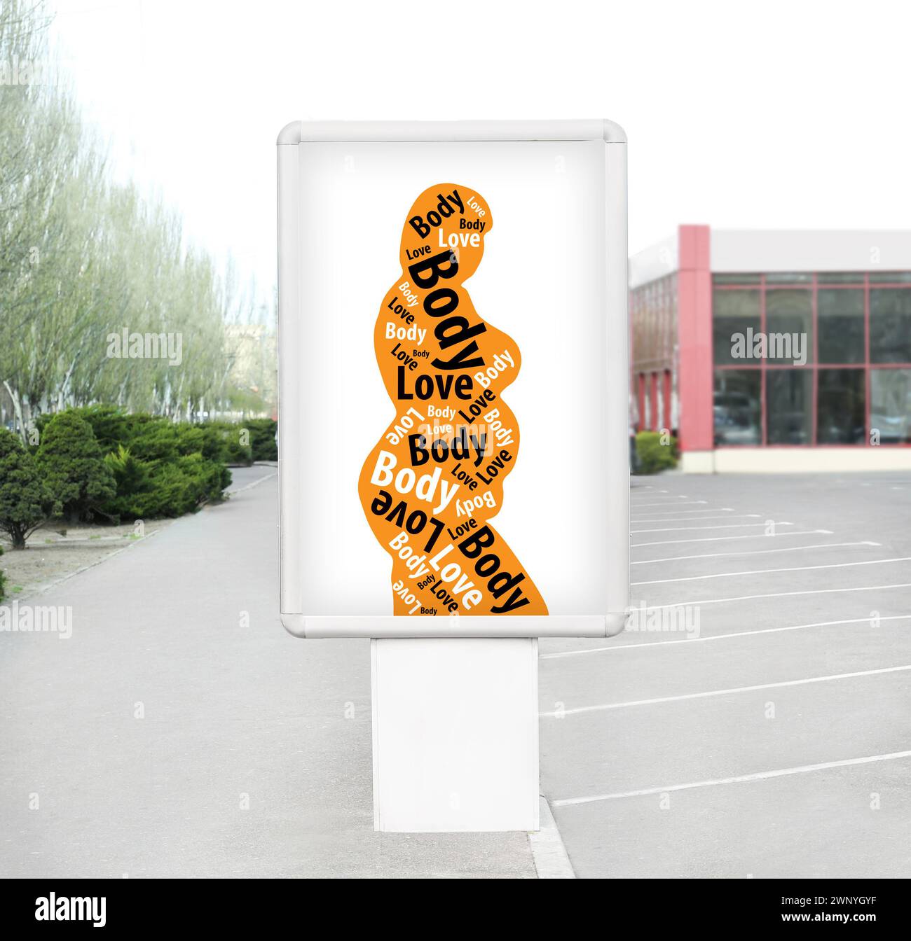 Signboard with orange silhouette of plus-size model with words Body ...