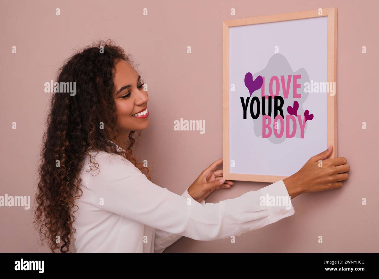 Stop body shaming and love yourself. Smiling woman hanging body ...