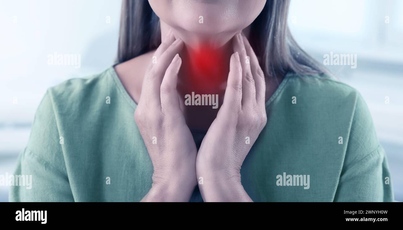 Endocrine system. Woman doing thyroid self examination indoors, closeup ...