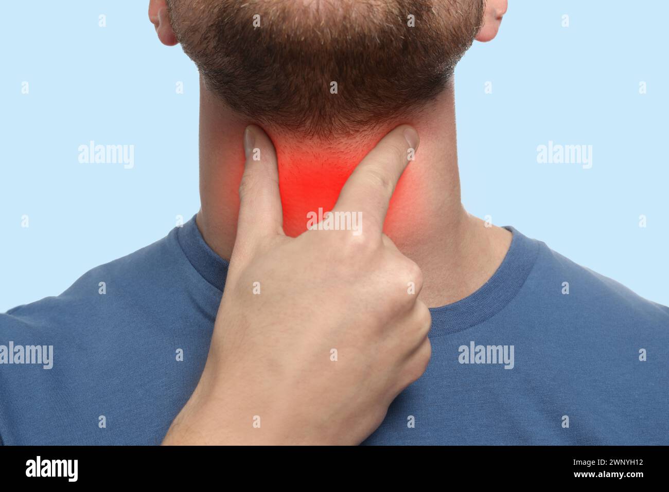 Endocrine system. Man doing thyroid self examination on light blue ...