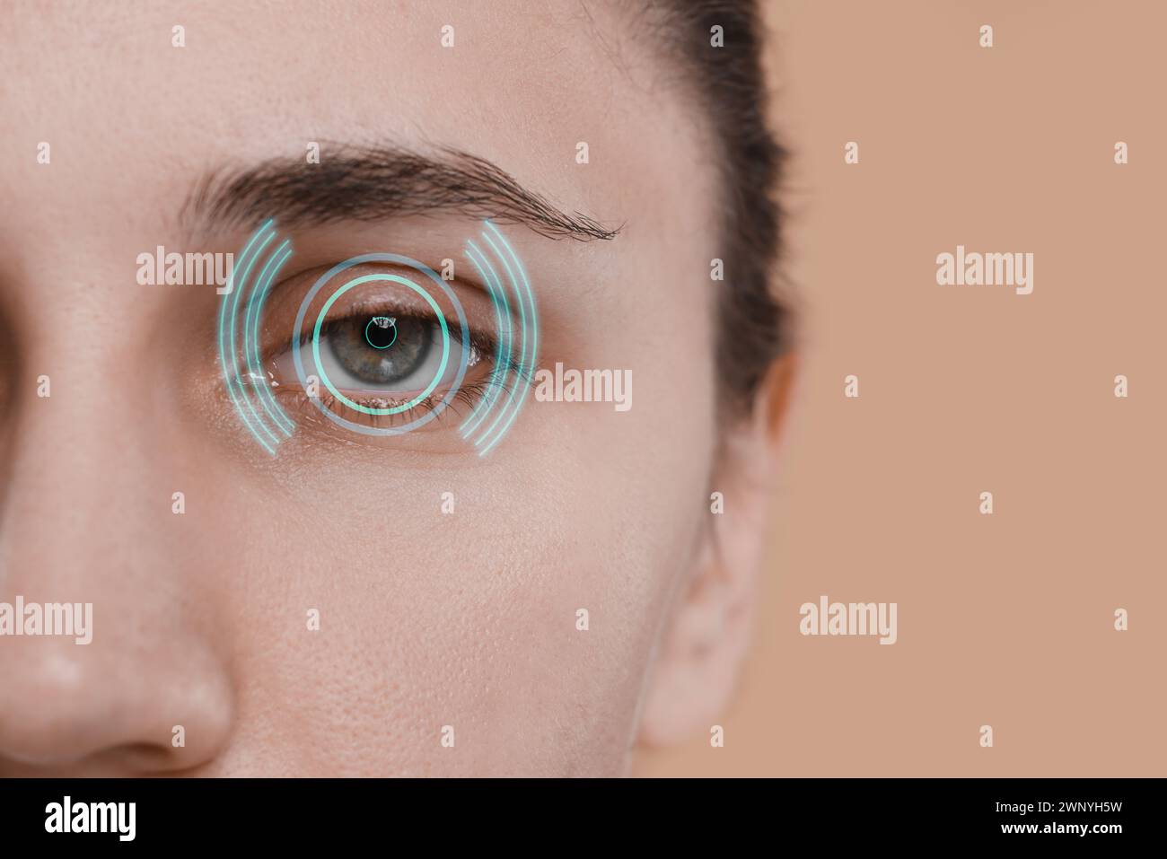 Vision test. Woman and digital scheme focused on her eye against beige ...