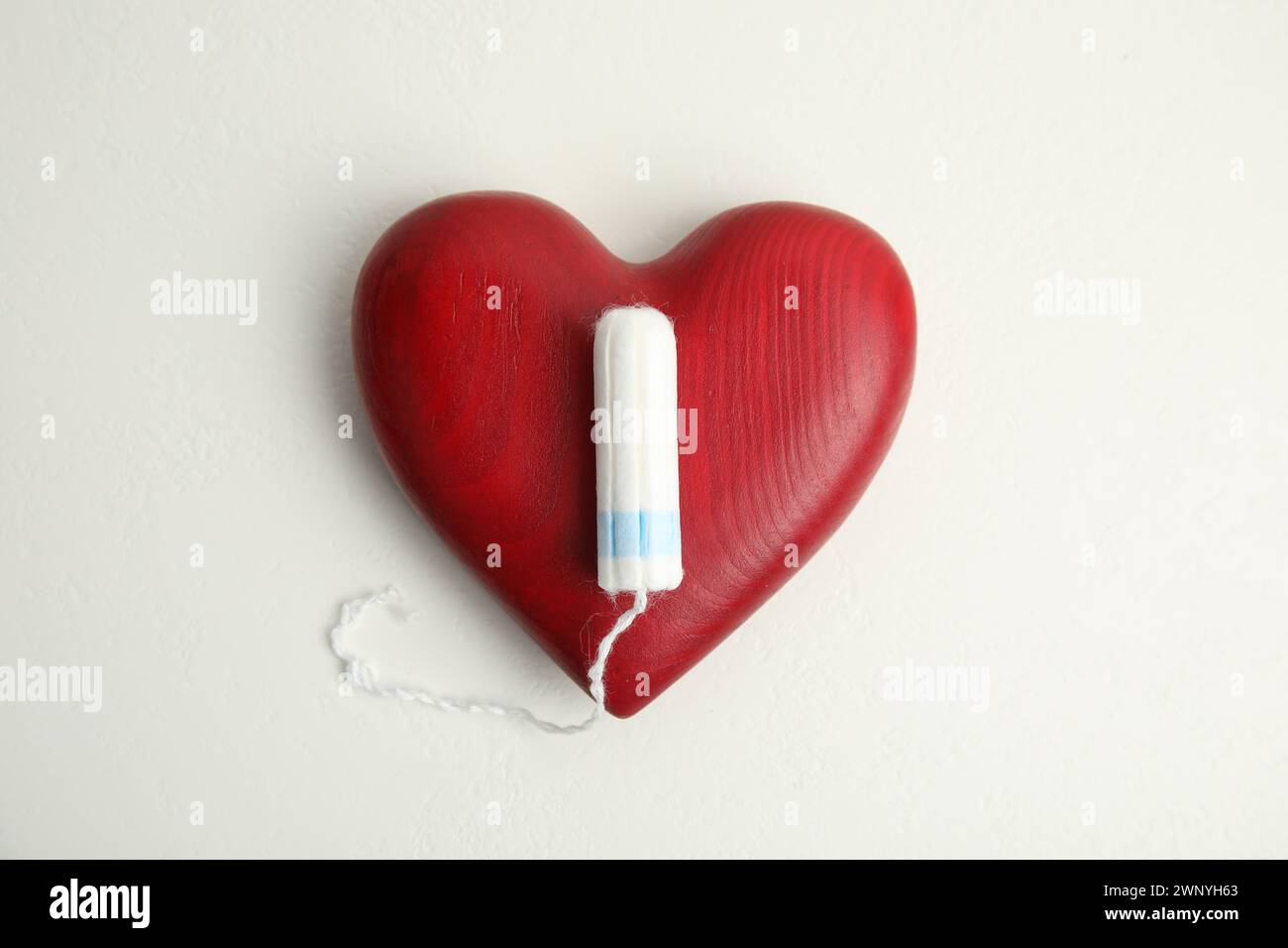 Tampon and red heart on white background, flat lay Stock Photo - Alamy