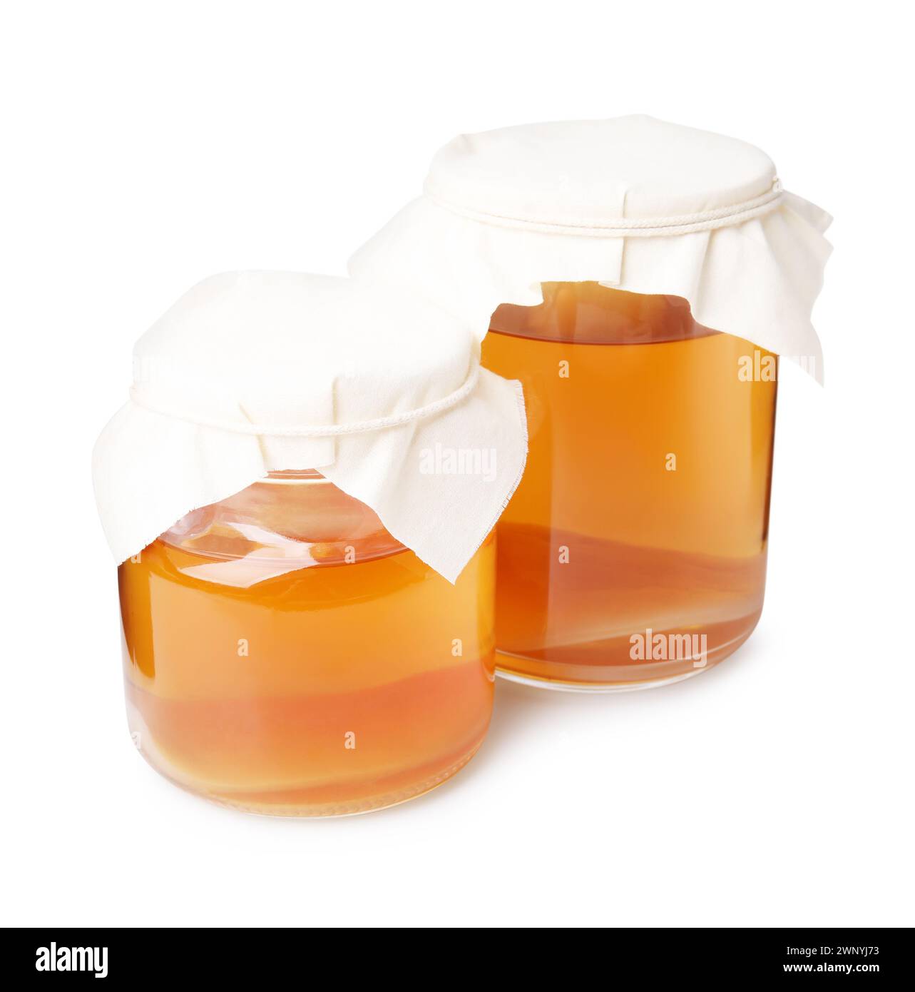 Tasty kombucha in glass jars isolated on white Stock Photo - Alamy