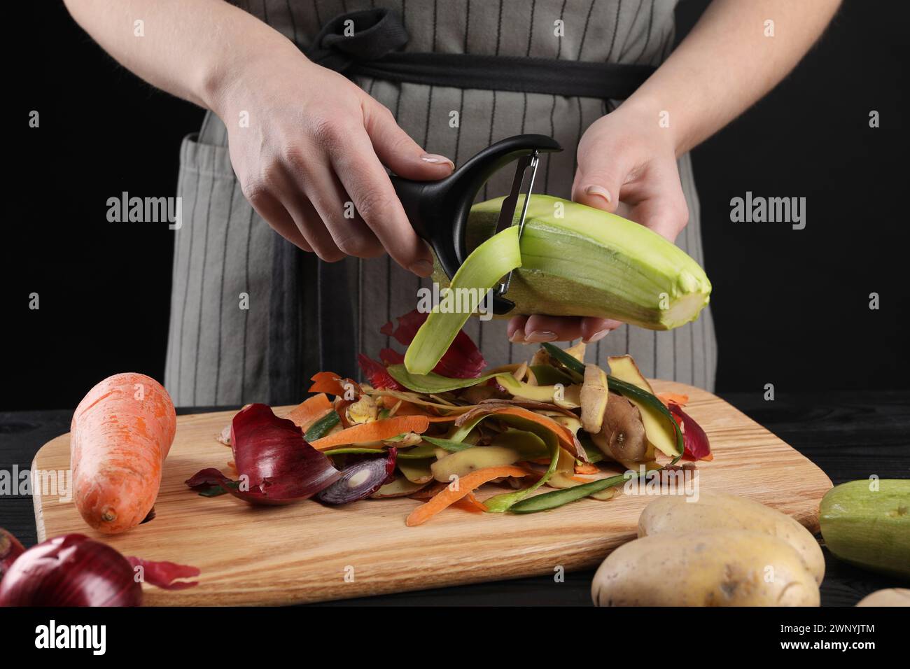 Hand peel potato zucchini hi-res stock photography and images - Alamy