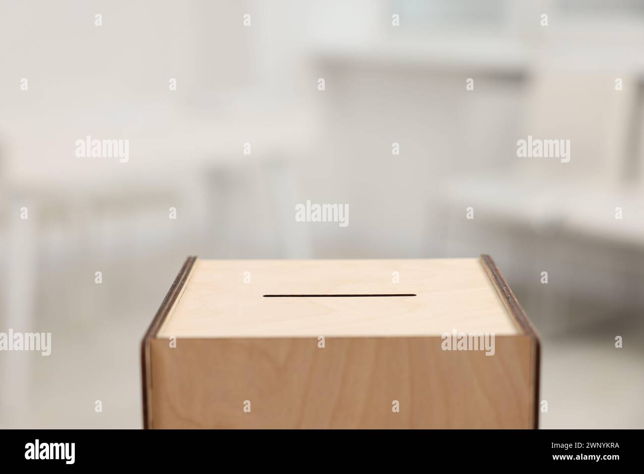 Wooden ballot box on blurred background, closeup. Space for text Stock ...