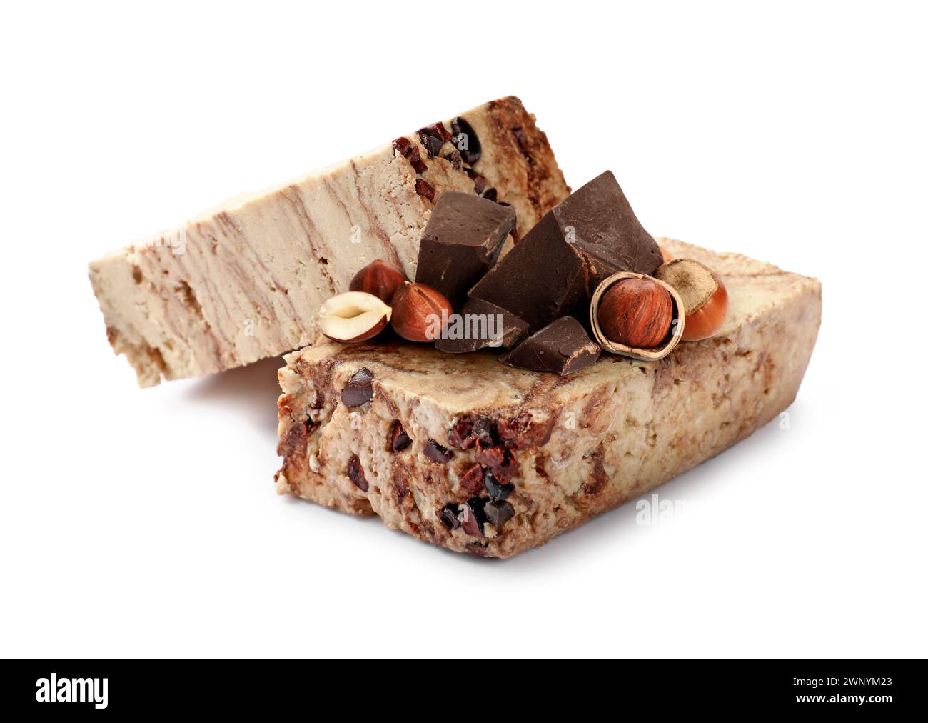 Tasty halva, pieces of chocolate and hazelnuts isolated on white Stock Photo - Alamy