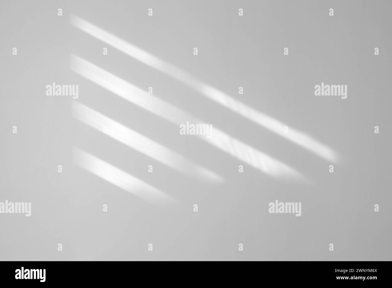 Light and shadows falling on white wall Stock Photo - Alamy
